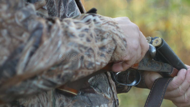 Hunter, loading a gun. stock video. Video of murder - 159791031