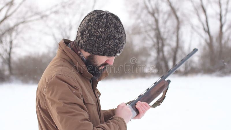 Hunter Loading the Gun before the Hunting Outdoors. Slow Motion Stock ...