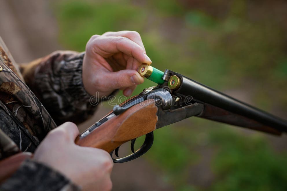Hunter loading rifle stock photo. Image of holding, season - 86365202