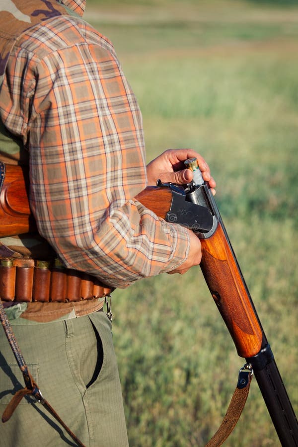 Hunter loading shotgun stock photo. Image of ammunition - 54032822