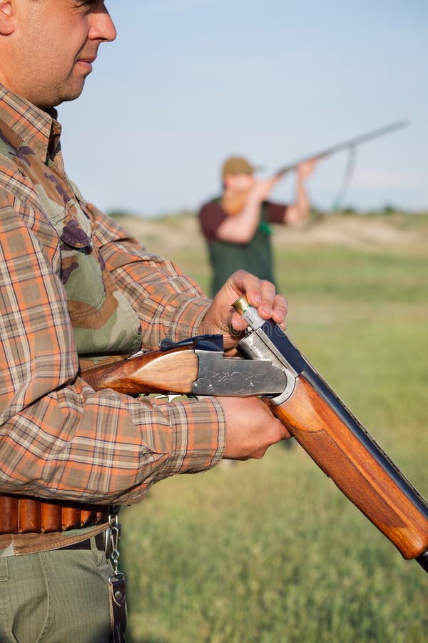 Hunter loading shotgun stock photo. Image of landscape - 54063598