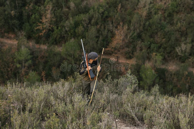 Hunter Walking through Forest Carrying Rifle on Shoulder Stock Image ...