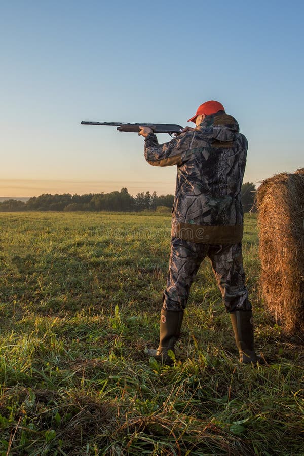 Man Shooting Birds in Field Stock Image - Image of outdoor, hunting ...