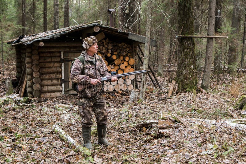 Hunter Near a Hunting Lodge Stock Image - Image of bushcraft, hike ...