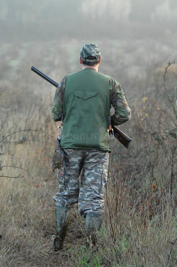 Hunter portrait stock image. Image of bird, solitude, vegetation - 5231685