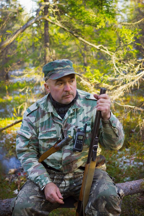 Hunter Resting, Sitting on a Log Stock Image - Image of guard, hunting ...