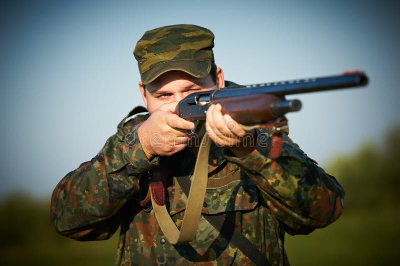 Hunter with rifle gun stock image. Image of camo, aiming - 20954441