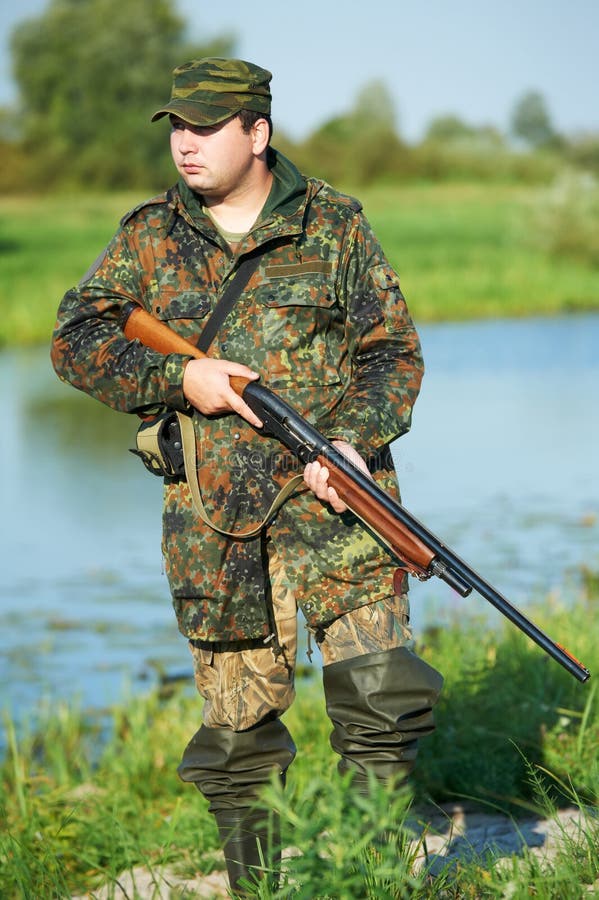 Hunter Shooting with Rifle Gun Stock Photo - Image of holidays, duck ...