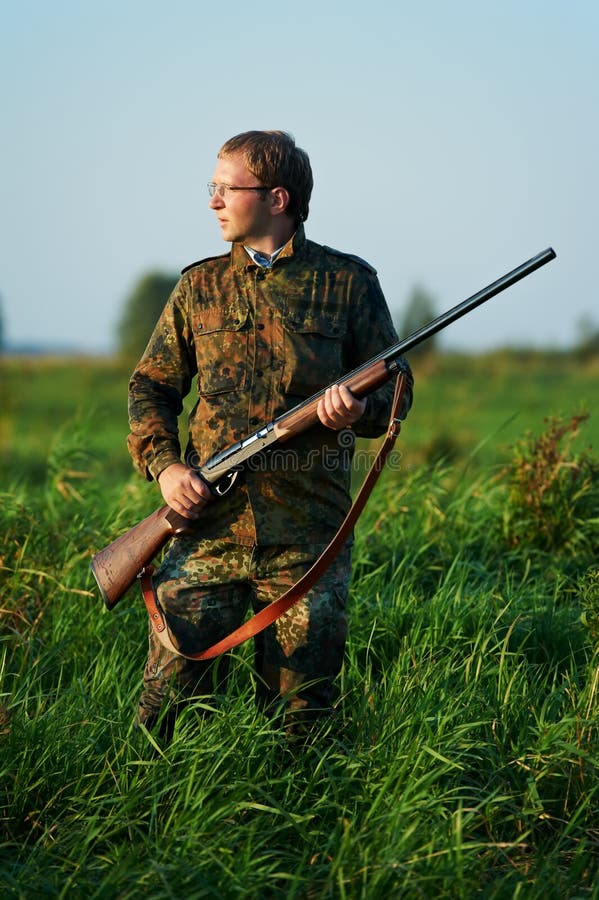 Hunter with rifle gun stock image. Image of male, nature - 21628977