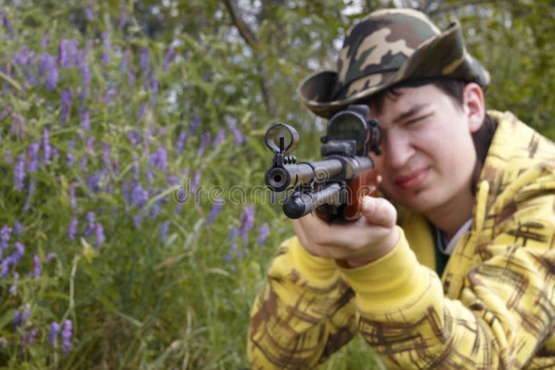 Hunter shooting up stock photo. Image of scope, grass - 10033768