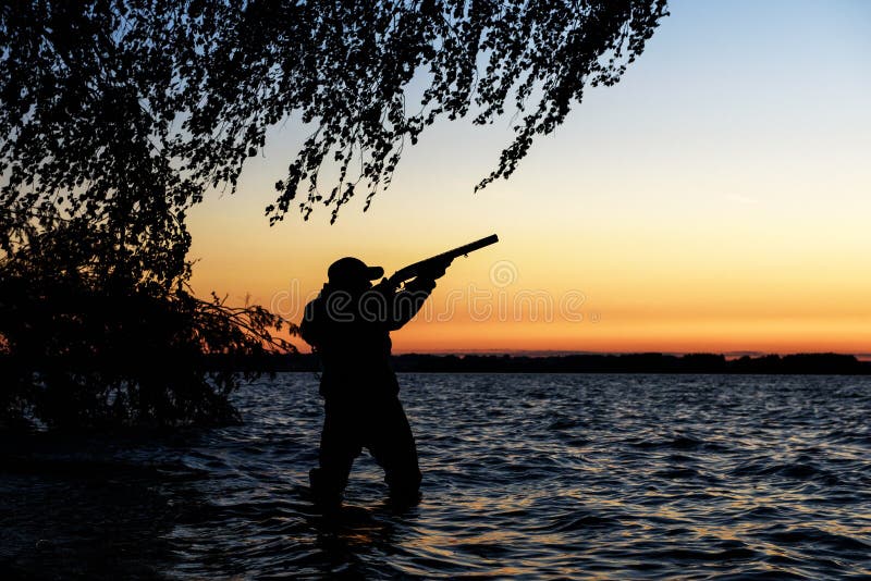 Hunter Silhouette At Sunset Stock Image - Image of grass, silhouette ...
