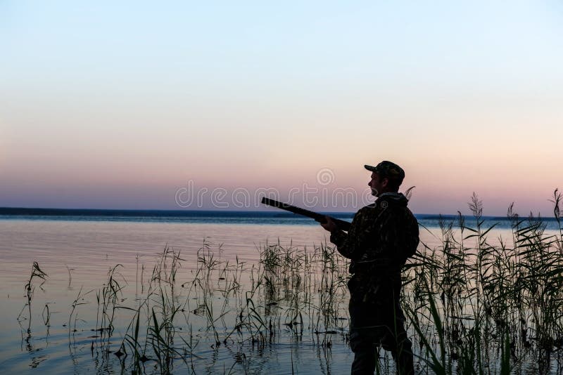 Hunter Silhouette at Sunset Stock Photo - Image of sunset, beautiful ...