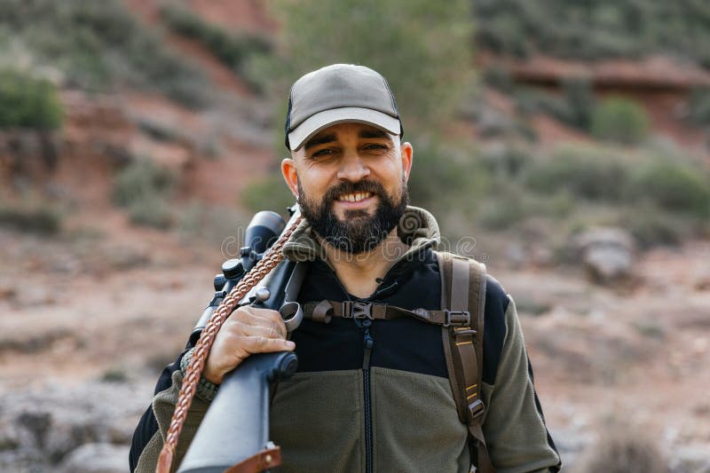 Hunter Smiling and Holding Rifle on Shoulder Stock Photo - Image of ...