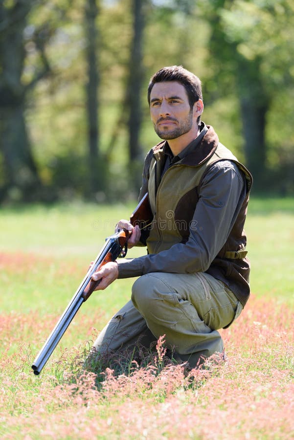 Hunter Standing in Swamp in Forest with Rifle Stock Image - Image of ...
