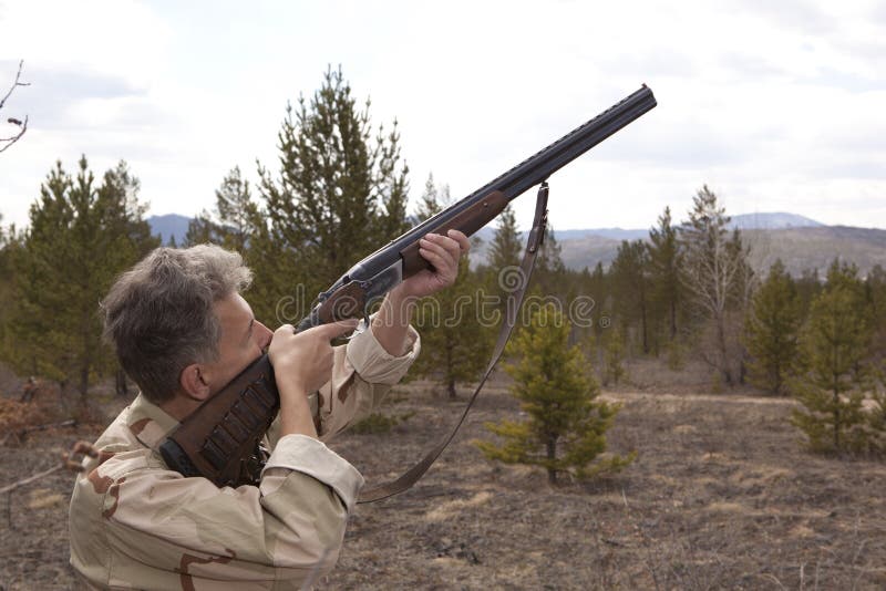 Hunter To Hunt With Hunting Rifle Stock Photo - Image of hunt, clothing ...