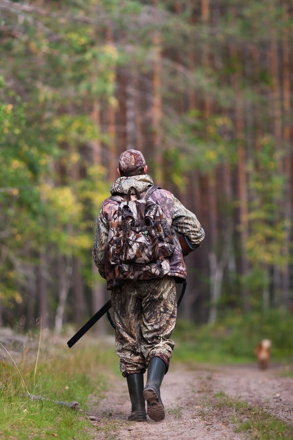 Hunter walking a field stock image. Image of hunter, snowy - 22539241