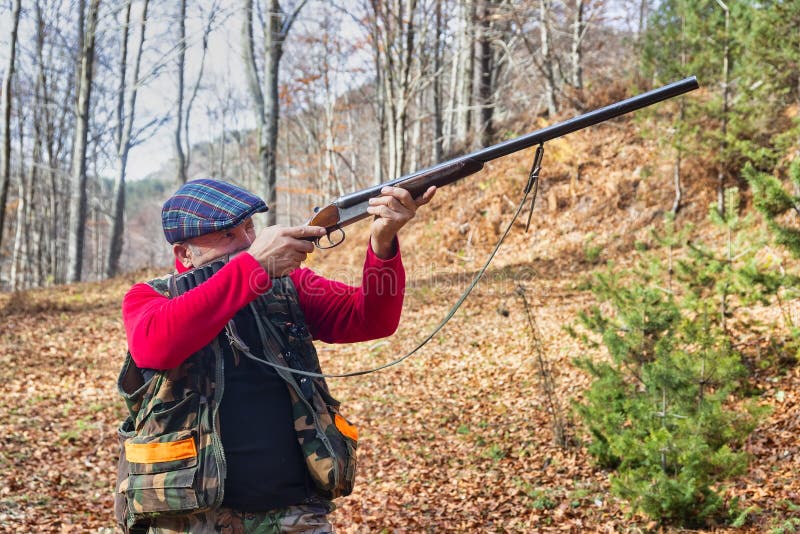 Hunter With Weapon Chasing In The Forest. Stock Photo - Image of forest ...