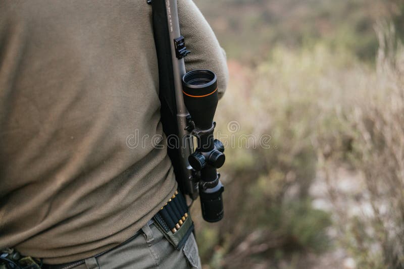 Hunter Wearing Rifle with Scope Walking through Woods Stock Image ...