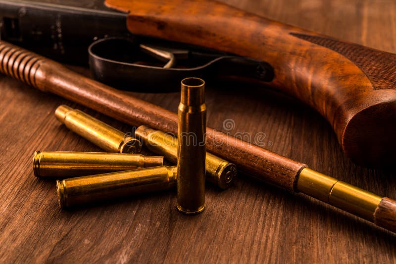 Hunting Rifle with Empty Shells and a Ramrod for Cleaning Weapons Lying ...