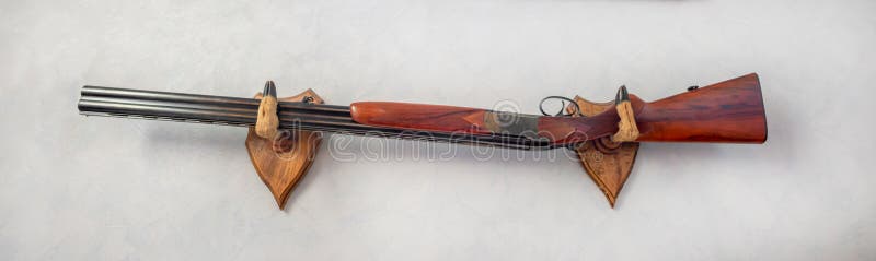 Hunting Rifle Hanging on a Wall with Deer Foot Gun Rack Stock Photo ...