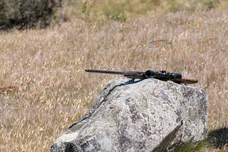 Hunting Rifle on the Top of a Boulder Stock Photo - Image of boulder ...
