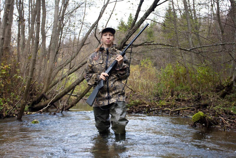 Huntress in Camouflage on the River Stock Image - Image of equipment ...