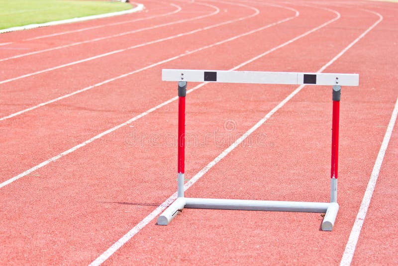 Hurdles on the Running Track in Stadium Stock Photo - Image of ...