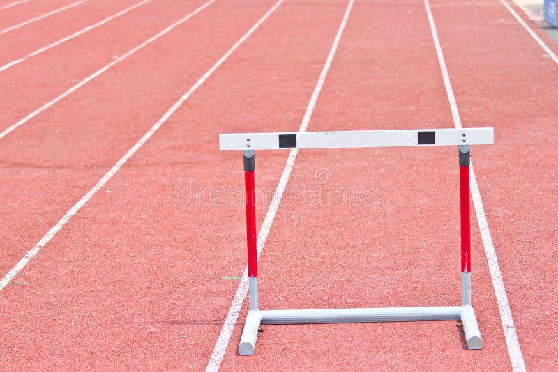 Hurdles on the Running Track in Stadium Stock Photo - Image of ...