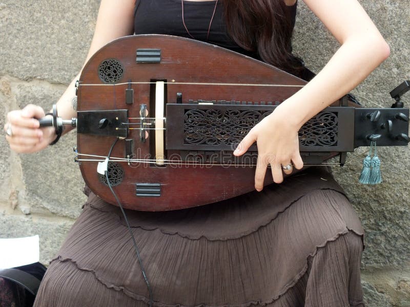 Playing the hurdy-gurdy stock photo. Image of band, gurdy - 244894142
