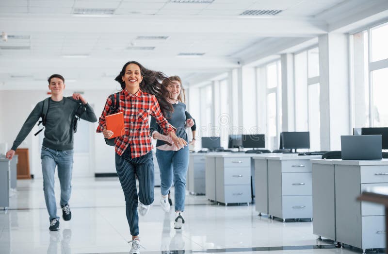 Hurry Up, Our Day is Done. Group of Young People Walking in the Office ...