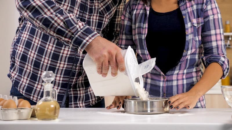 Husband Helping His Beautiful Wife with Dinner Stock Photo - Image of ...