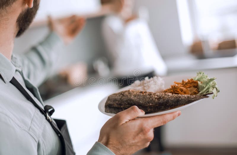 Husband with a Plate of Cooked Dinner Standing in the Kitchen Stock ...