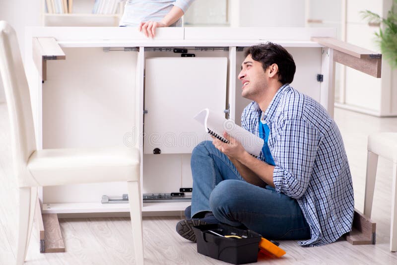 The Husband Repairing Broken Table at Home Stock Image - Image of ...