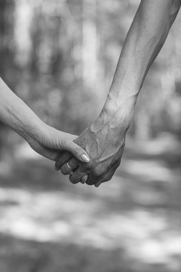 The Husbandand X27 S Flour Holds His Wifeand X27 S Hand Tightly In Close Up