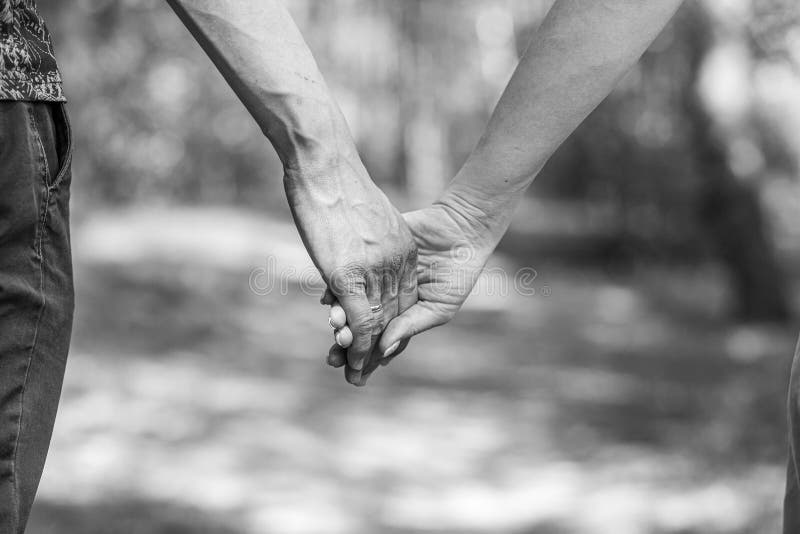 The Husbandand X27 S Flour Holds His Wifeand X27 S Hand Tightly In Close Up
