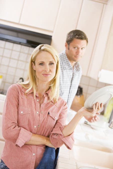 Husband and Wife Doing Dishes Stock Photo - Image of disgruntled ...