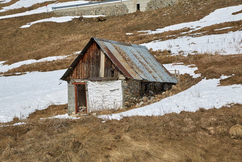 Hut on an Alpine slope stock image. Image of small, mountain - 245727943