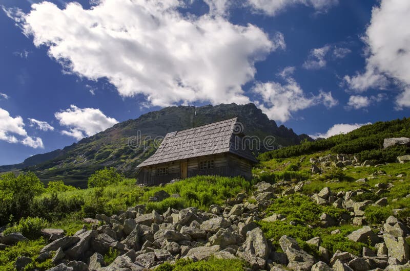 Hut in mountains. stock photo. Image of summit, blue - 47728816