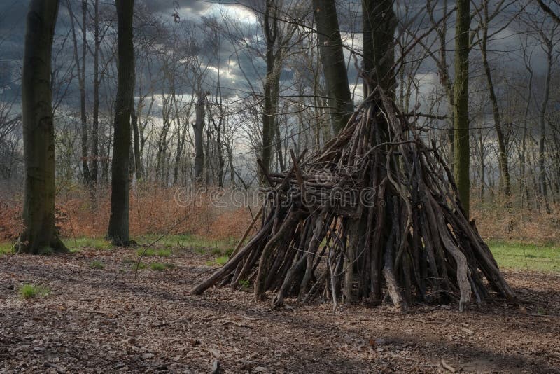 Stick Hut House in Forest. Dramatic Clouds in the Background Stock ...