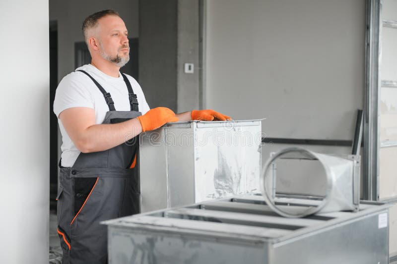 Hvac Services - Worker Install Ducted Pipe System for Ventilation and ...