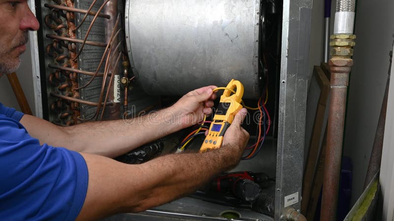 HVAC Technician Checking Current on Motor Wire Stock Video - Video of ...