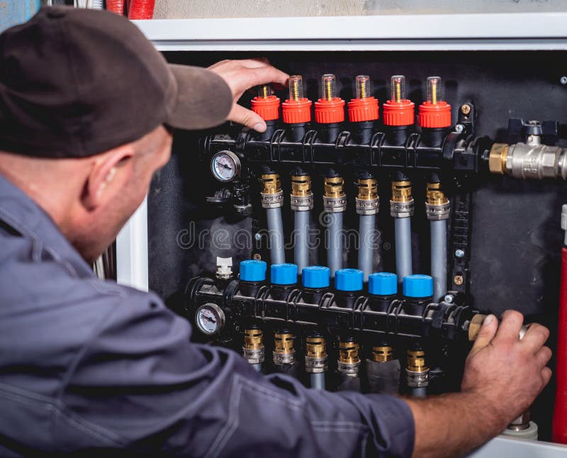HVAC Technician Servicing Home Heating and Cooling System Stock Photo ...