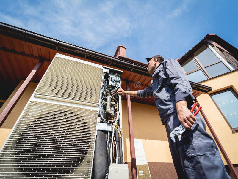 HVAC Technician Servicing Home Heating and Cooling System Stock Image ...
