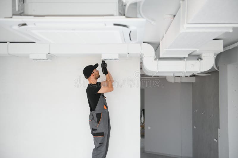 Hvac Technician at Work. Ventilation, Heating System Maintenance and ...