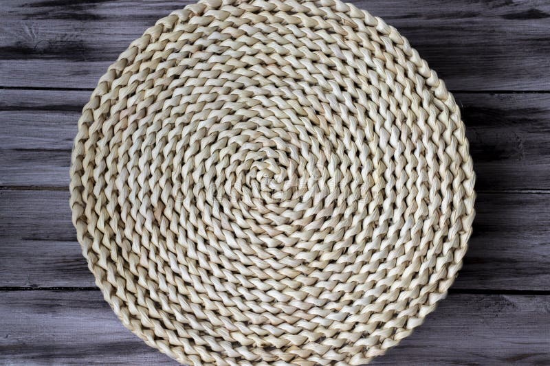 Hyacinth Wicker Round Kitchen Rug on a Wooden Table. Stock Image ...