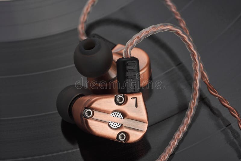 Hybrid Ear-buds on the LP Vinyl Record Stock Photo - Image of balanced ...