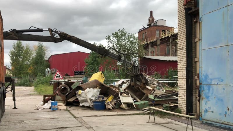 Hydraulic Claw Manipulator Carrrying Old Metal Scrap and Loading it in ...