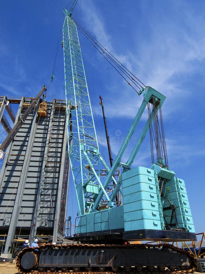 Crawler Cranes are Lifting Steel Beams To Install, for Building ...
