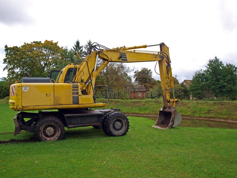 Hydraulic digger stock image. Image of green, pond, ground - 27086417