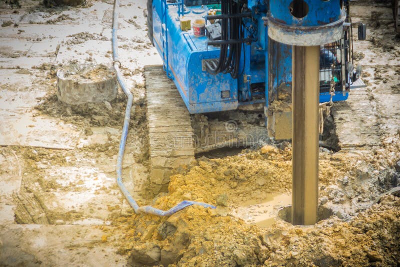 Hydraulic Drilling Machine is Boring Holes in the Construction Site for ...